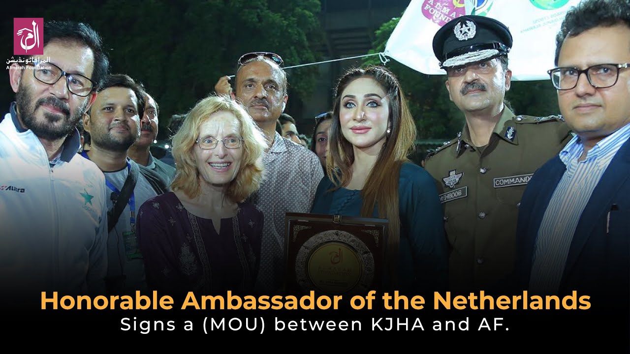 Henny Fokel DeVries, Honorable Ambassador of the Netherlands, signs a ...