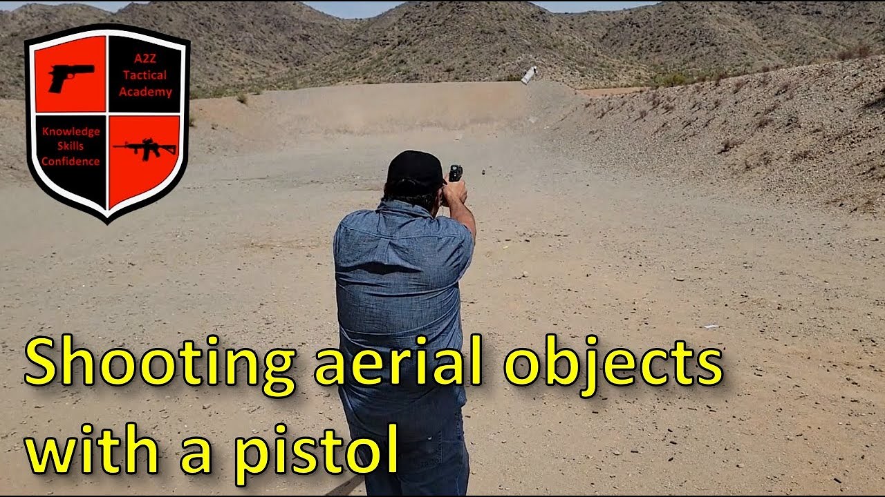 Shooting aerial object with a pistol - YouTube