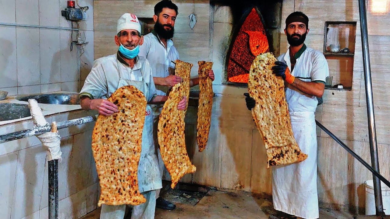 Original Sangak bread is baked on a hot stone in a bakery, Original ...