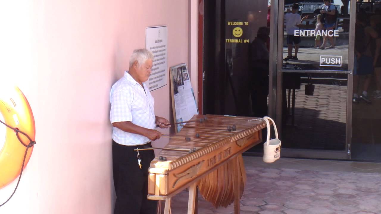 marimba player in belize - YouTube