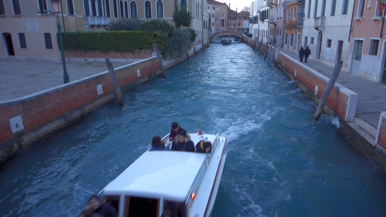 An opera singer on a boat in a canal in Venice, Italy - YouTube