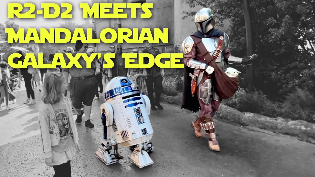 R2-D2 bumps into the Mandalorian at Star Wars Galaxy’s Edge at ...