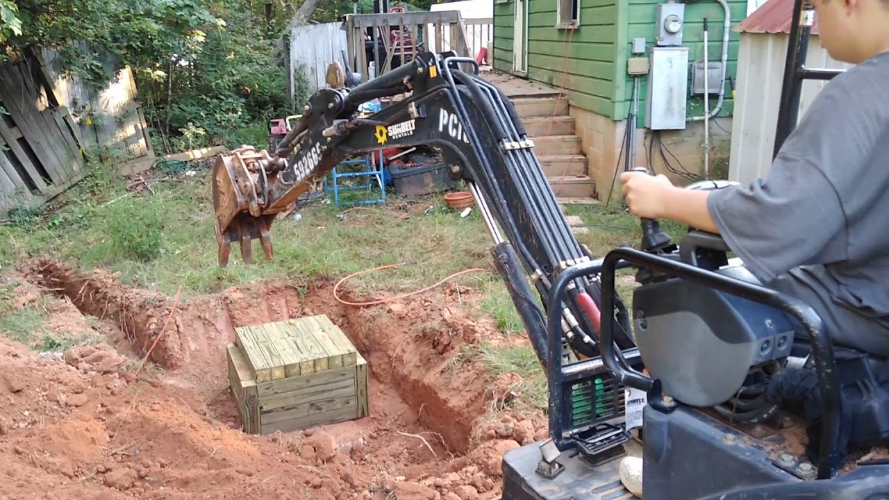 Digging up the septic system - YouTube