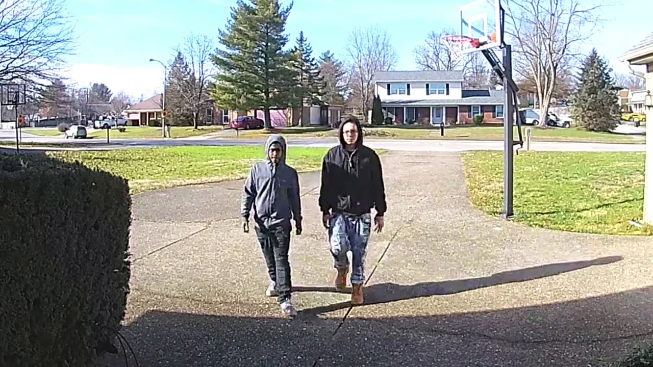 Two people walk up to home, walk away after seeing security camera ...