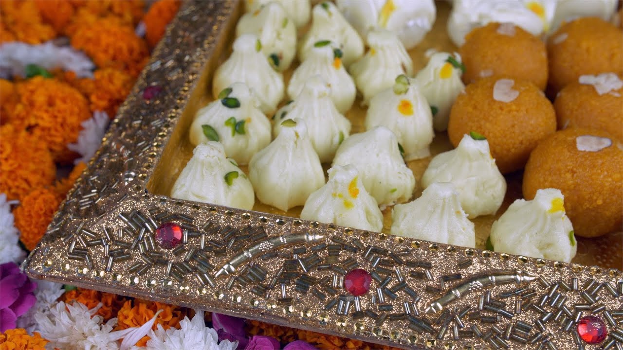 Closeup shot of mix mithai served in a beautiful silver tray o ...
