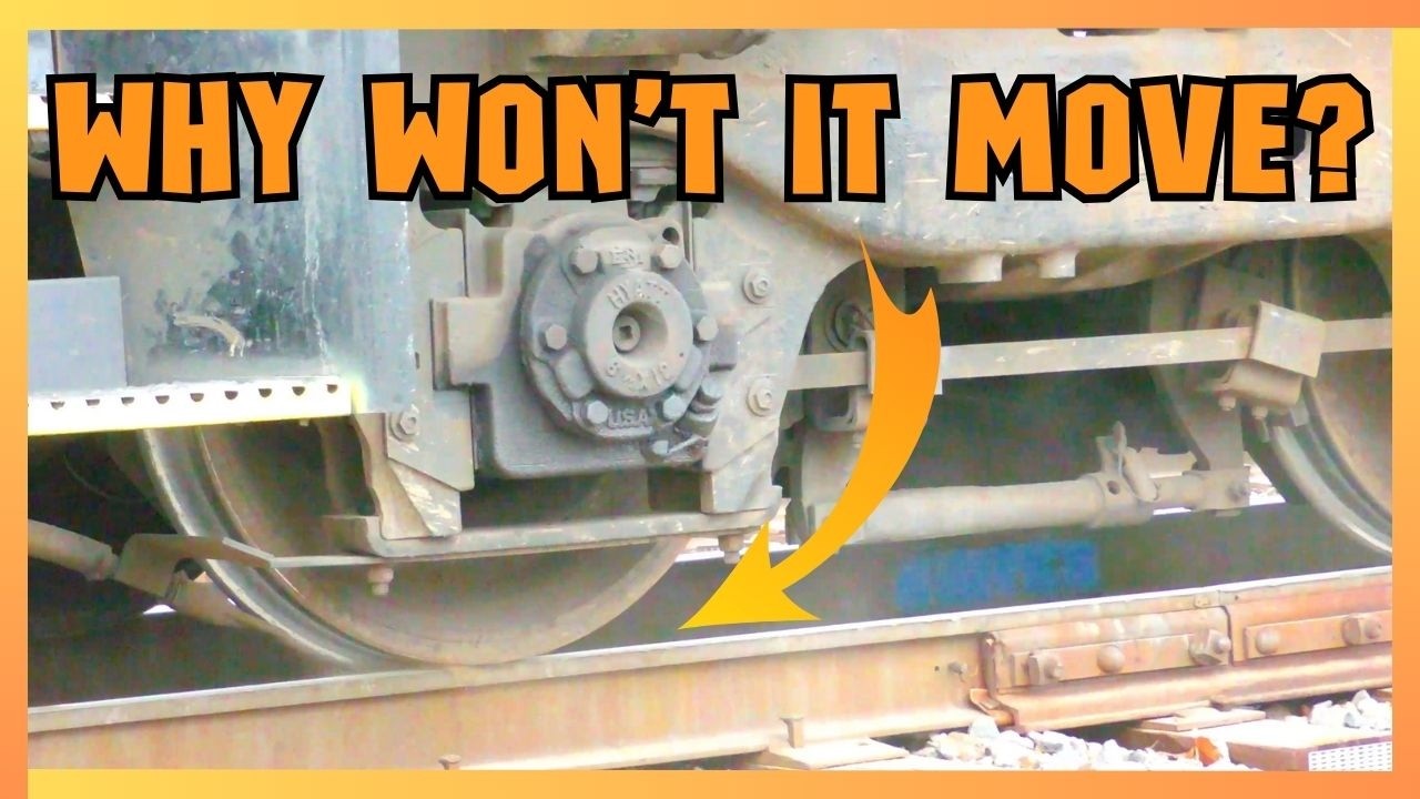Train gets stuck moving cars into the yard! Engineer gives it all she's ...