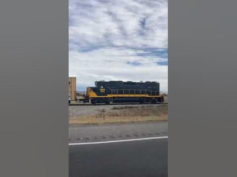WAMX GP38-2 3814 rolling away from Ucon running long hood forward with two TTX boxcars - YouTube