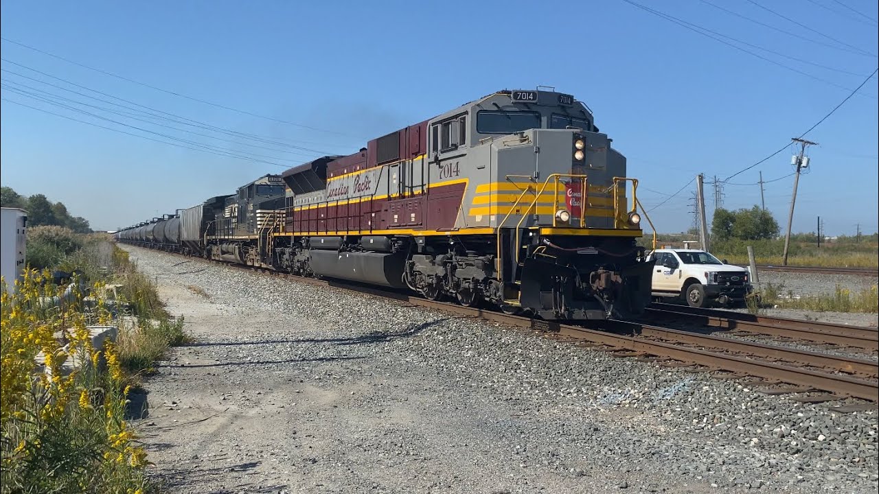 CP 7014 (Maroon&Grey) leads a tank train through Pine Junction - YouTube