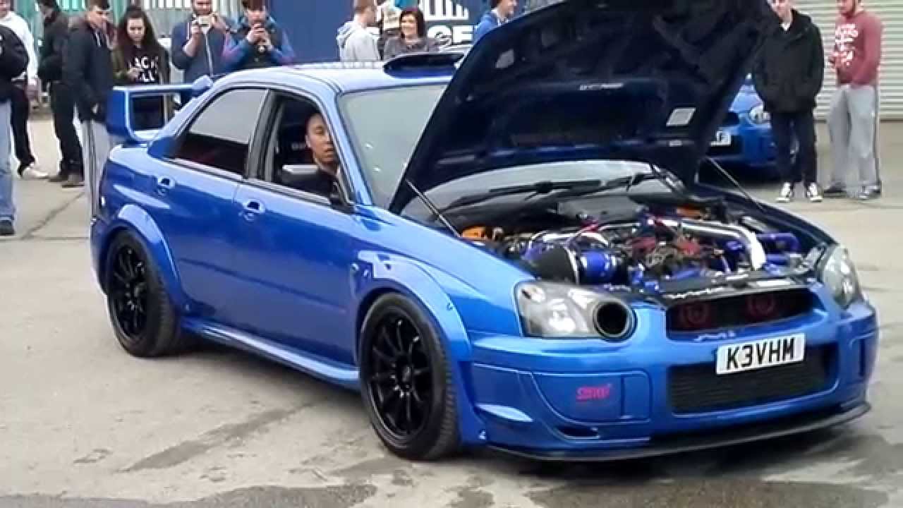 Subaru with side exhausts popping and banging - YouTube