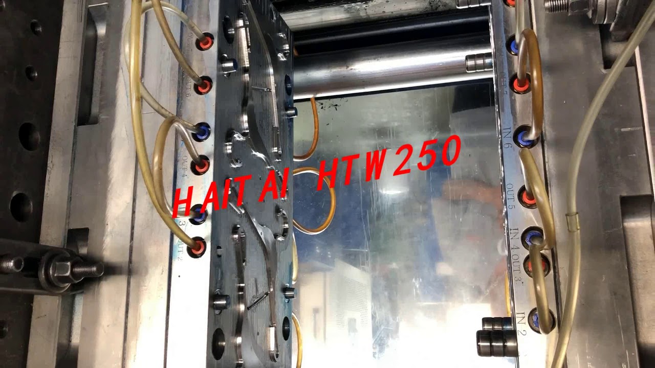 HAITAI INJECTION MOLDING MACHINES HTW250JD MAKING PLASTIC HANGERS - YouTube