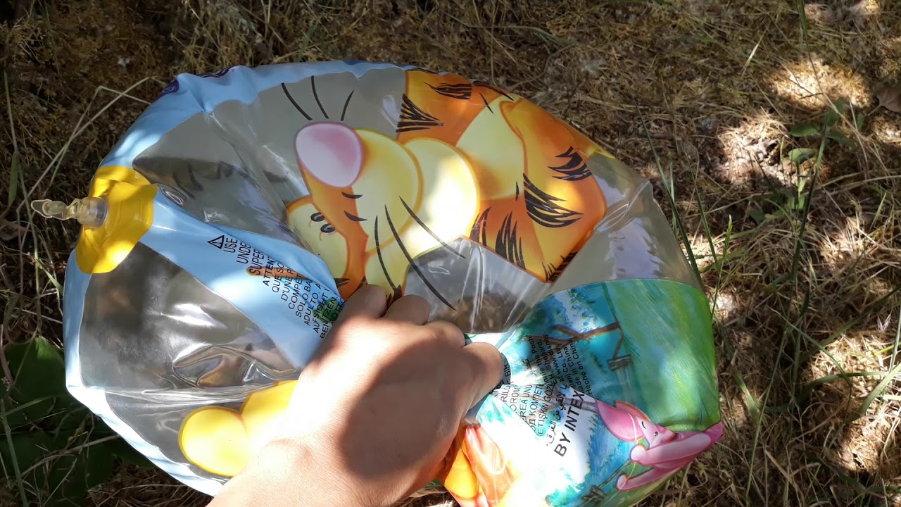 Winnie the Pooh beach ball deflating in out door - YouTube