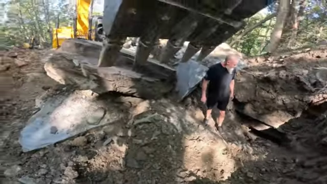 4000lb Hammer Breaking Rock. - YouTube