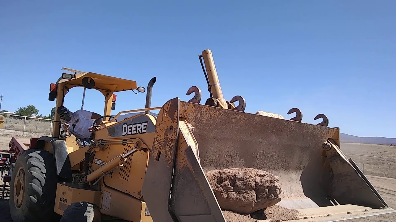 Removing large rocks from arena. - YouTube