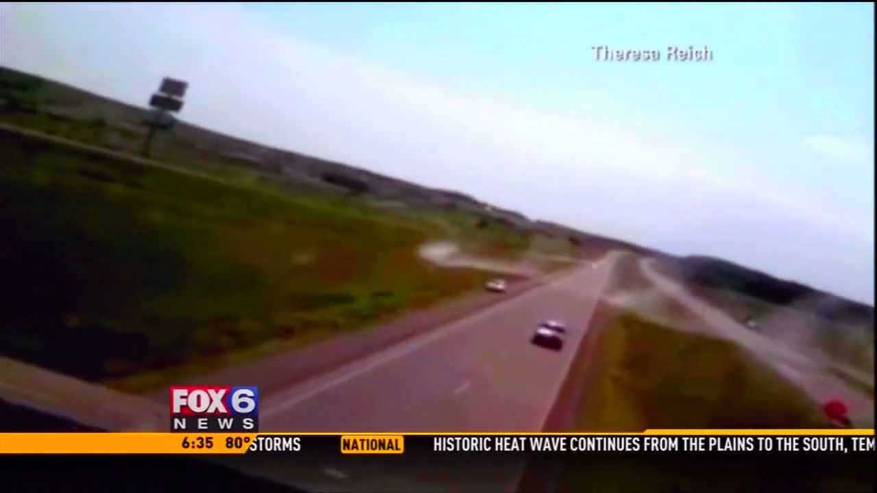 SUV goes airborne when it hits a bump in the road - YouTube