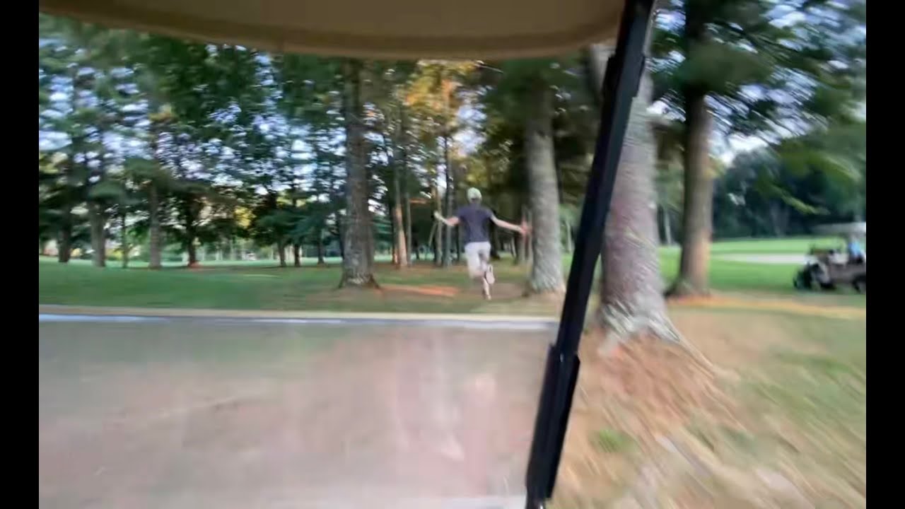 Kid runs for his life as angry golfer tries to hit him with cart - YouTube