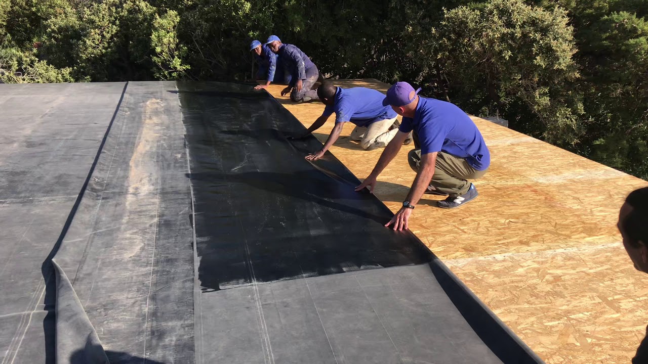 How to adhere EPDM Rubber Membrane to a Flat Timber Roof - YouTube
