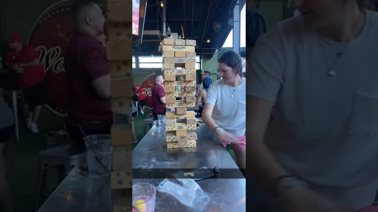 Woman tries to do a Jenga trickshot, but fails miserably! - YouTube