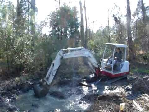 Mud bogging with the mini Excavator - YouTube