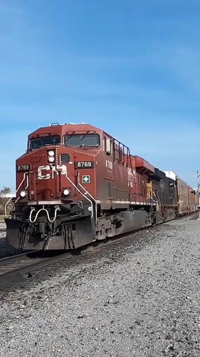 CP locomotive 8769 and CSX locomotive 3412 lead a westbound Autorack ...