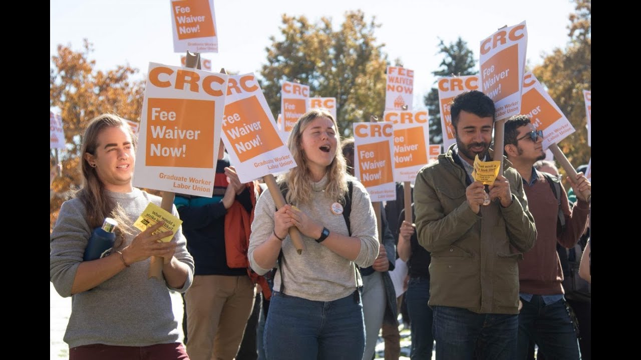 Graduate students march in protest of mandatory fees - YouTube