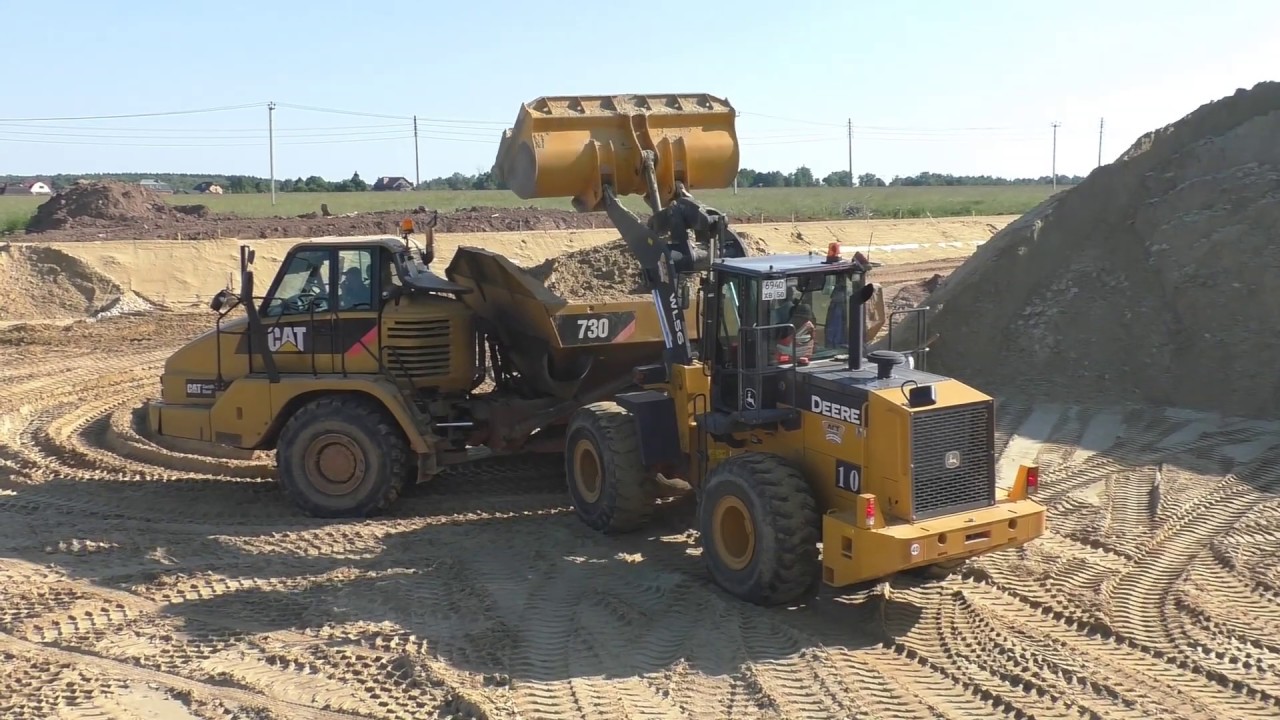 John Deere WL56 loading Cat 730 ADT part 2 - YouTube