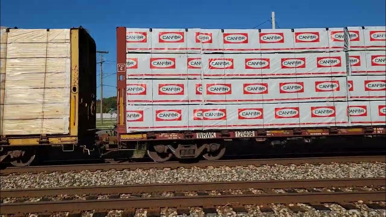 CN 5246, 5419 Westbound local freight train with lumber on flat cars, WC, ICG gondolas at ...