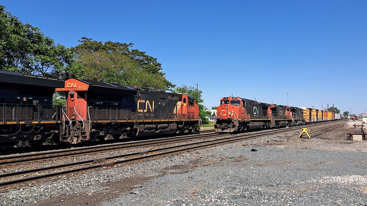 Train Meet and an IC Death Star! CN M397 Passes an Eastbound Freight at ...