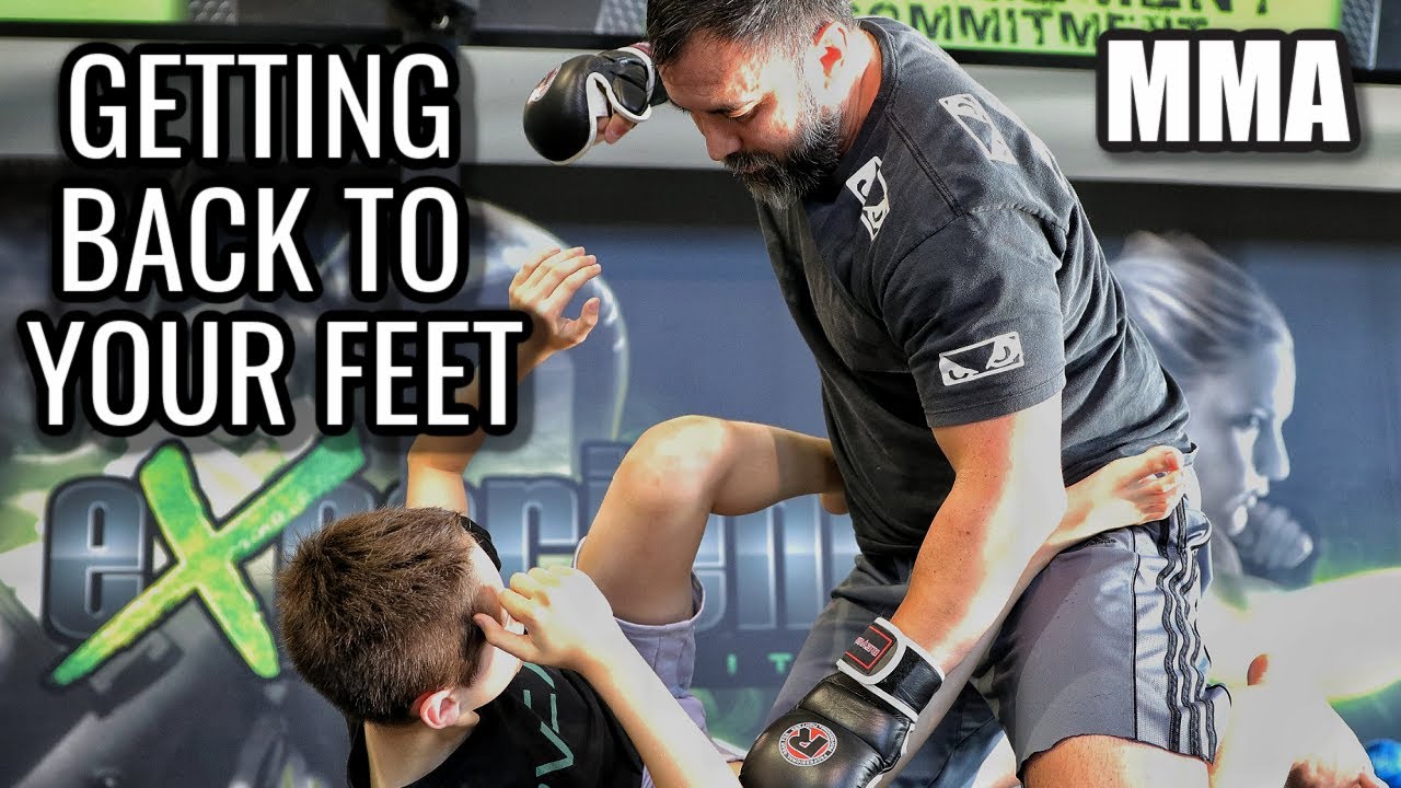 Defending Yourself & Standing Back Up from Your Guard in MMA - YouTube
