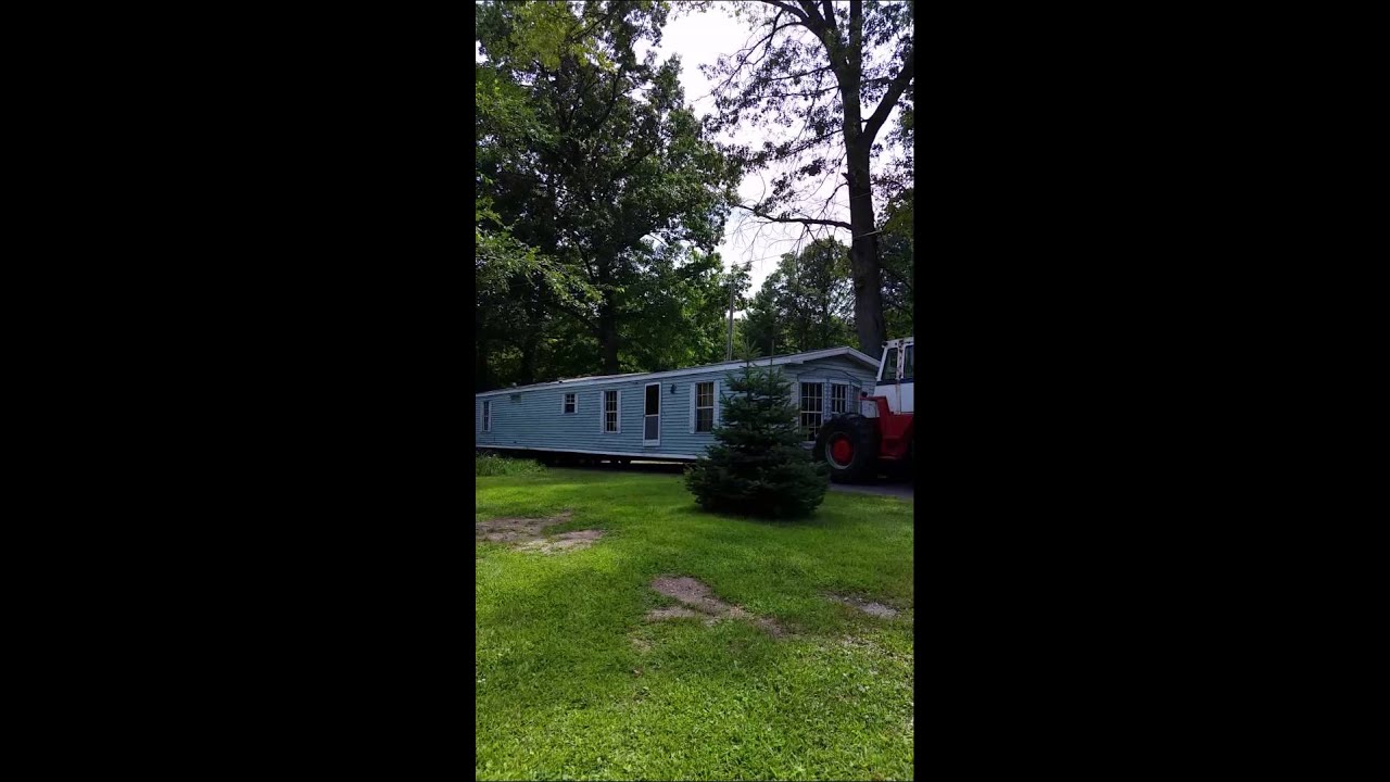 Moving a mobile home, the redneck way! - YouTube