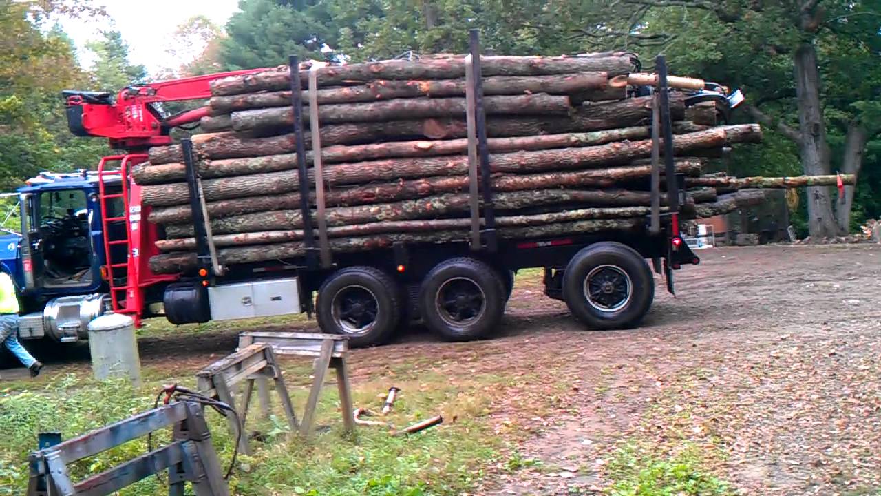 log truck delivers wood - YouTube