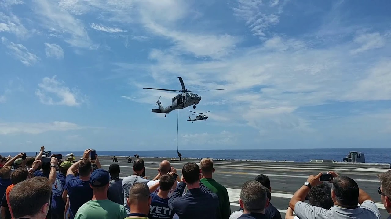 U.S. Navy EOD team fast rope ship boarding demonstration aboard USS ...