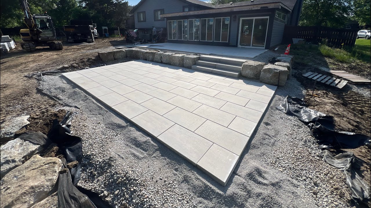 Screeding and laying slab style pavers - YouTube