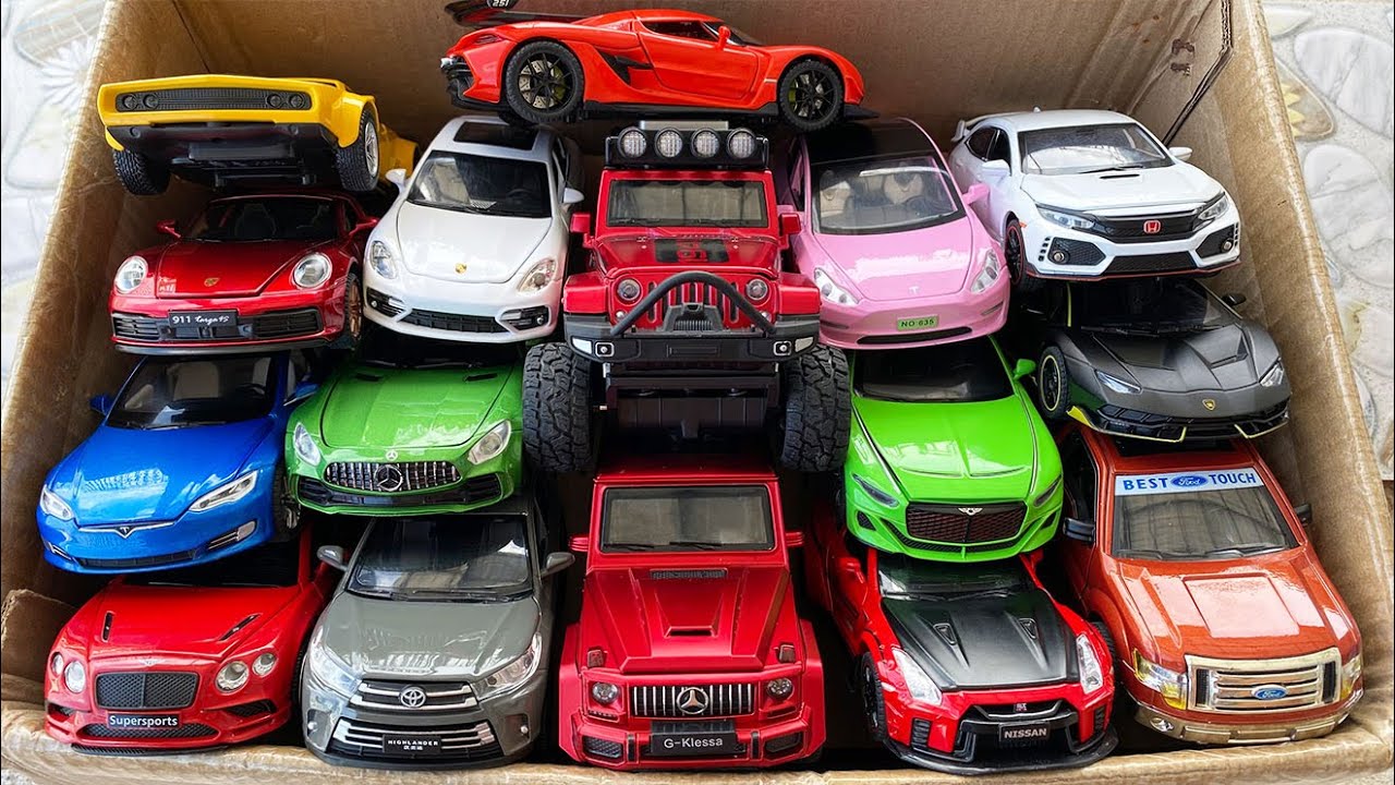 Box full of welly diecast metal mini cars, jeep, koenigsegg jesko ...