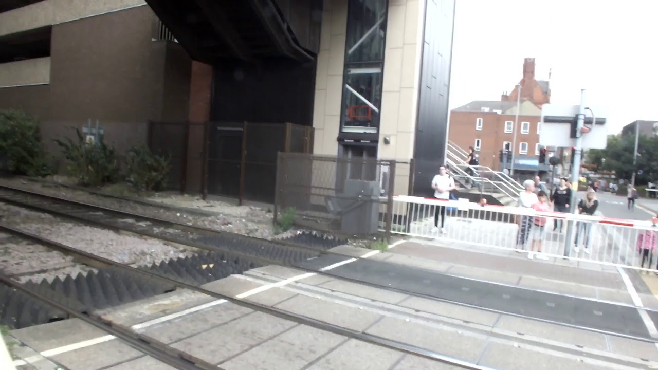 Freight Trains comes in crossing over the road - YouTube