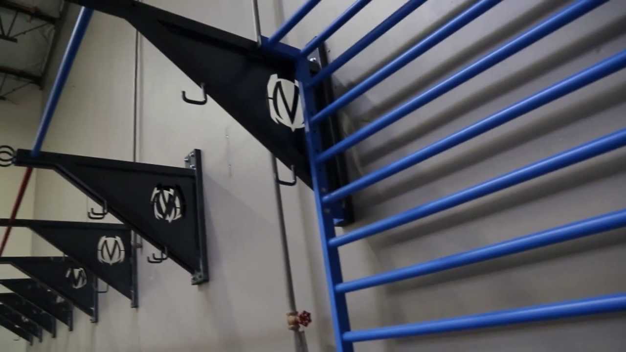 Stall bars as part of pull-up bar system installed at a fitness club ...