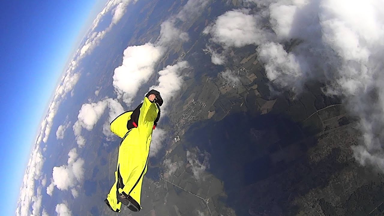 wingsuit first flight course second try - filmed by the coach - YouTube