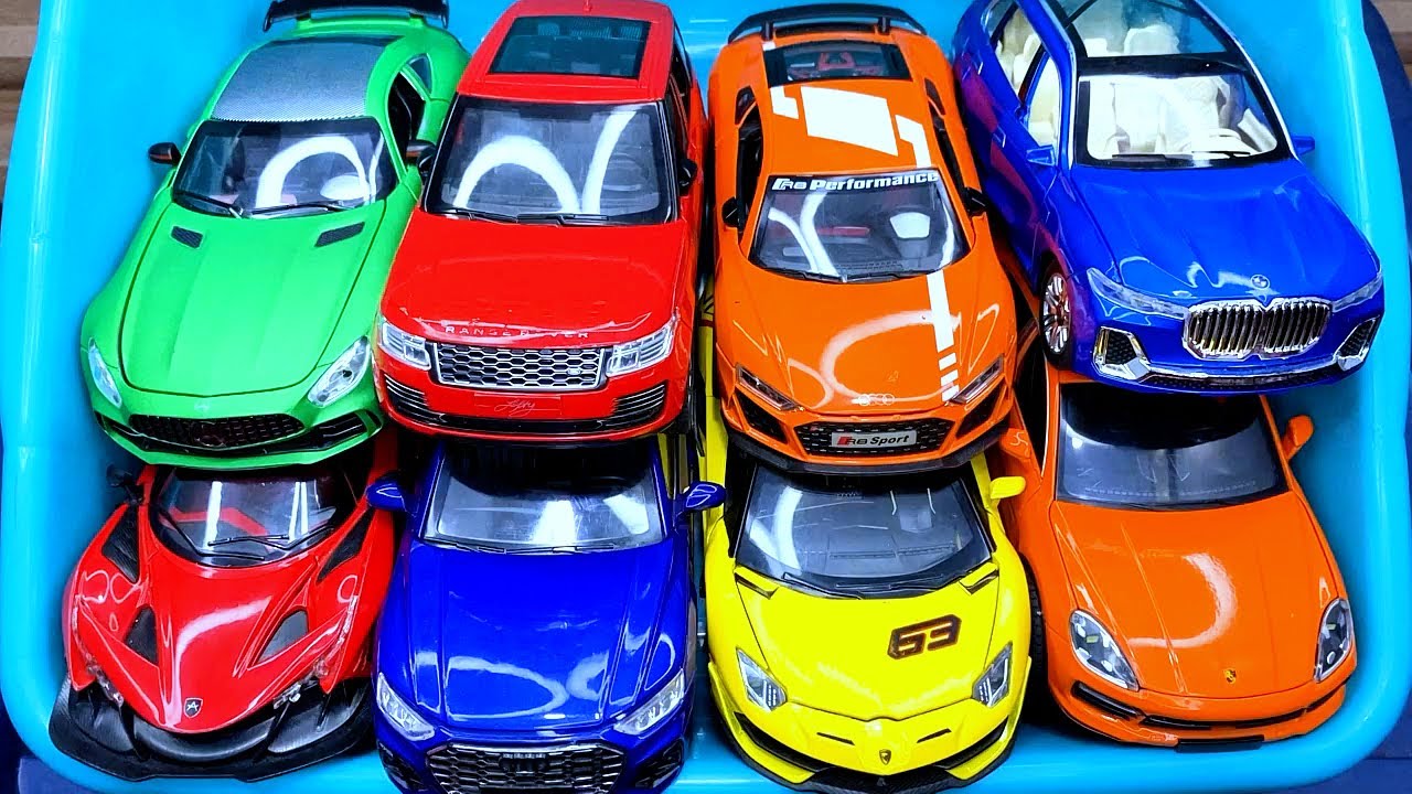 Box full of various miniature cars Jaguar, Peugeot, Renault, Hyundai ...