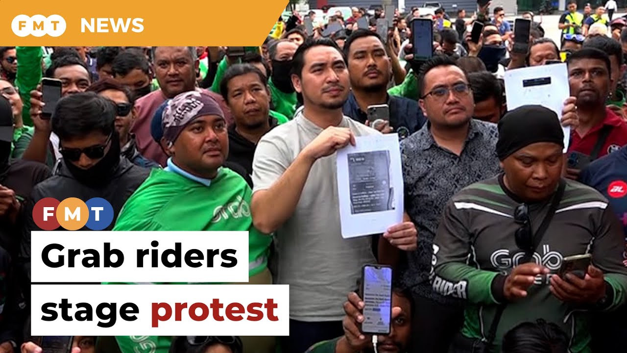 300 Grab riders stage protest, want issues resolved in 5 days - YouTube