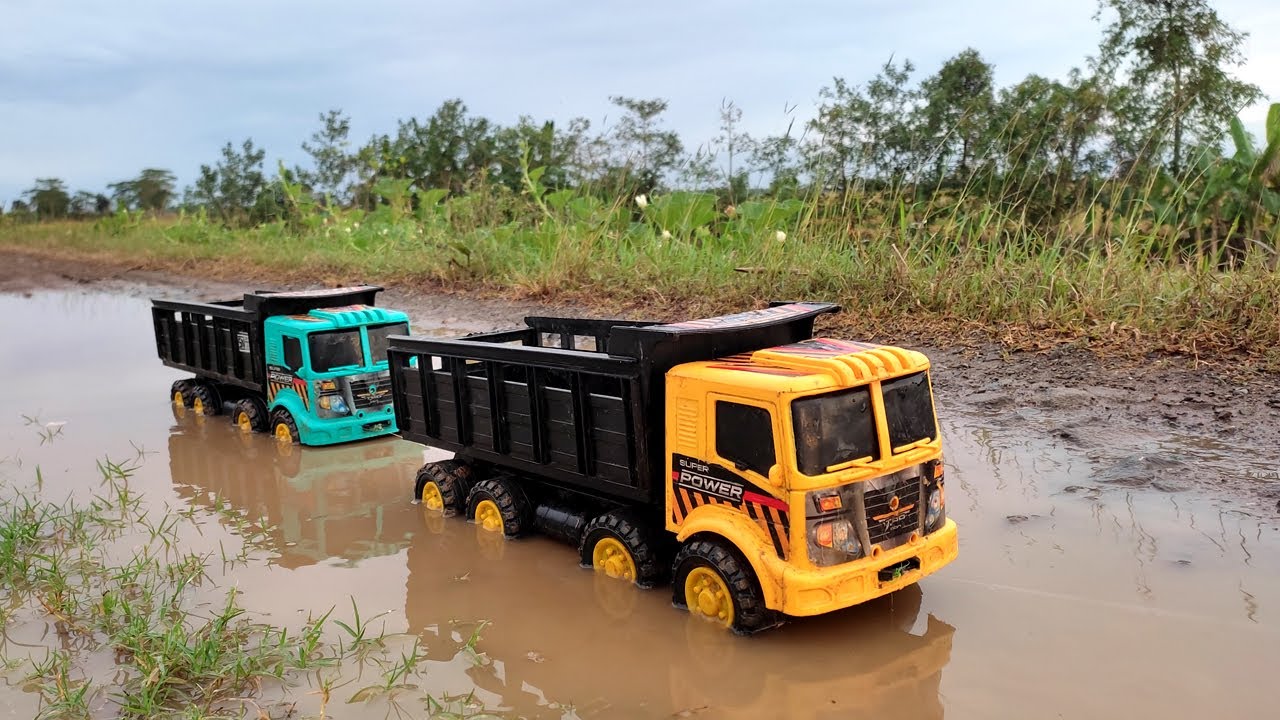 MOBIL TRUK MAINAN TELOLET TELOLET LIBAS JALAN BANJIR - YouTube