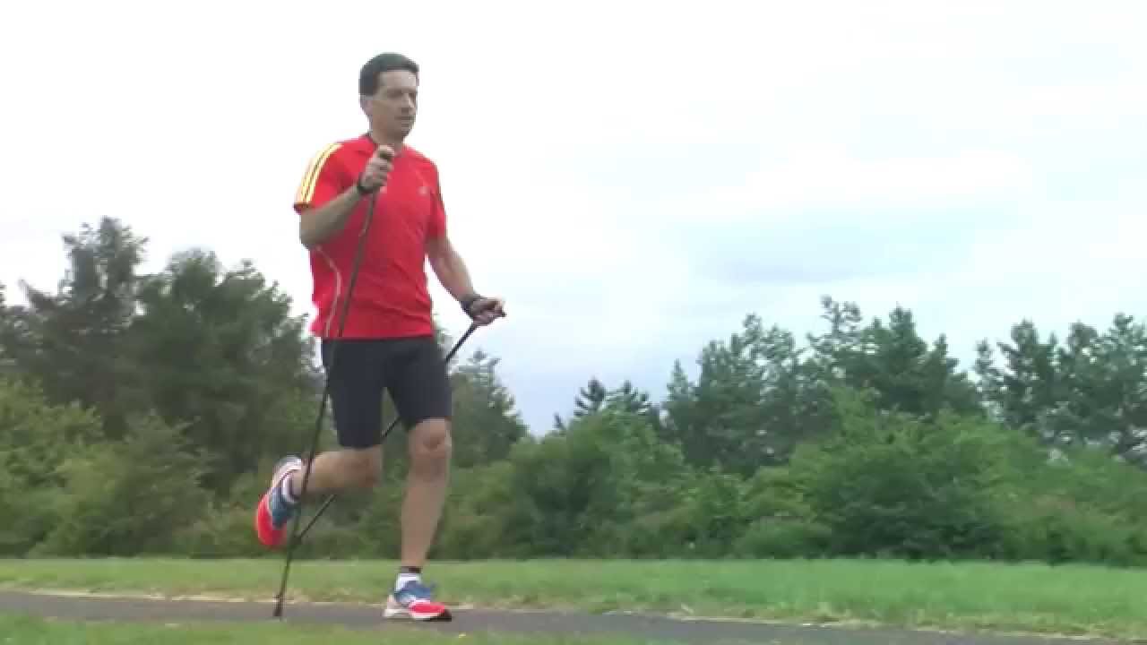 running with poles on a hard surface - YouTube