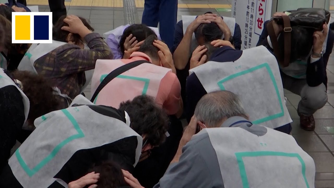 Tokyo holds drills amid fears of North Korean missile attack - YouTube