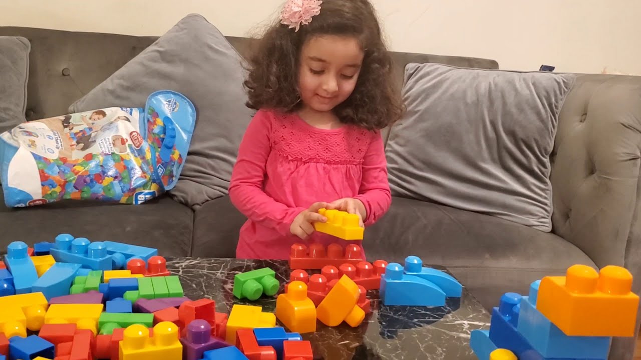 Dania playing with blocks and making different shapes is fun and ...