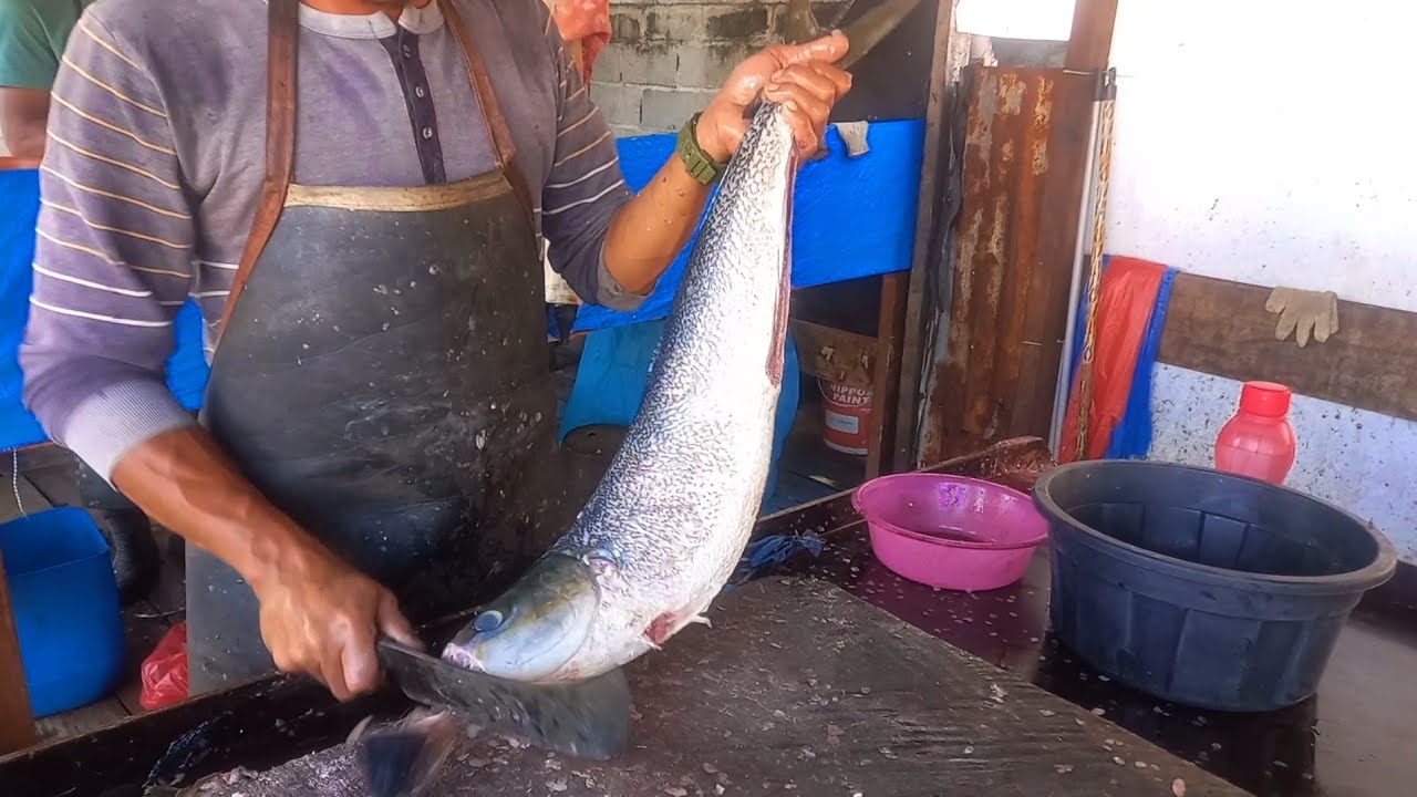 THIS MAN'S SKILL IN CUTTING FISH VERY QUICKLY AND ALSO VERY BEAUTIFULLY ...