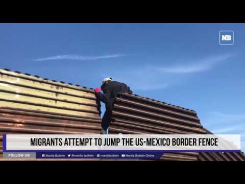 Migrants attempt to jump the US-Mexico border fence - YouTube
