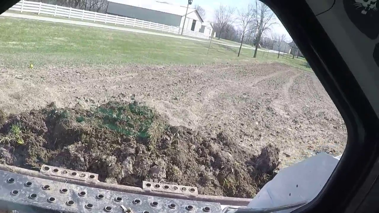 Building up dirt along the driveway - YouTube