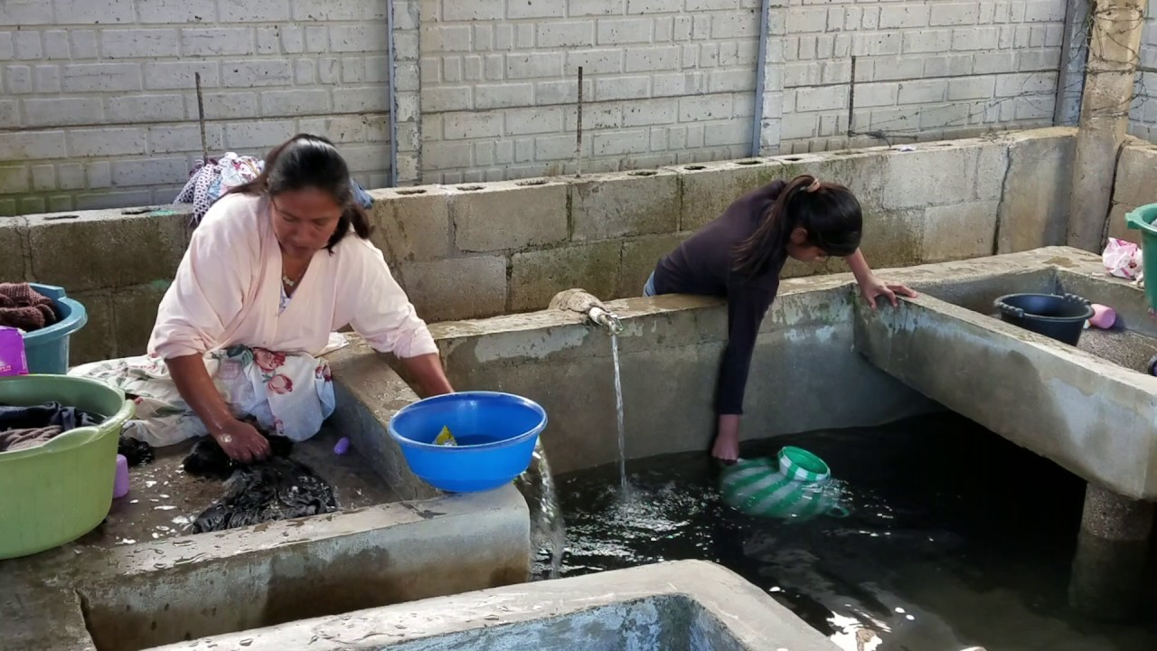 Local Villagers Washing Clothes at the Central Watering Point - YouTube
