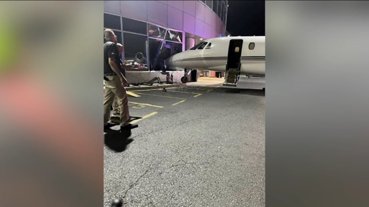 Nose of jet crashes through window of terminal at Teterboro Airport ...