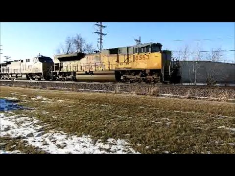 UP 8563 a SD70ACe leads a Z train with a horn salute east through Geneva IL - YouTube