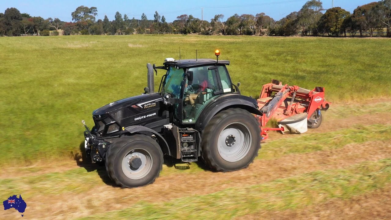 Mowing Hay with Black Deutz-Fahr Warrior 6215 and KUHN Mower in rough ...
