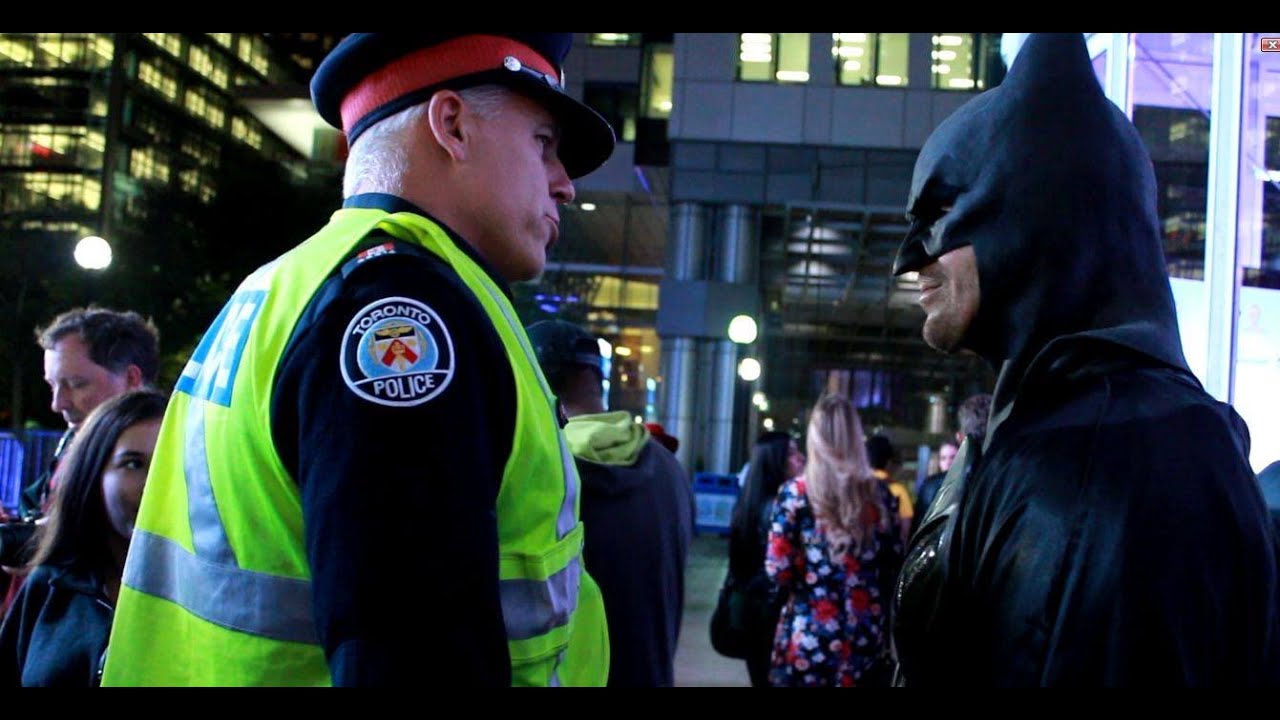 Police officer threatens to arrest Batman in Toronto - YouTube